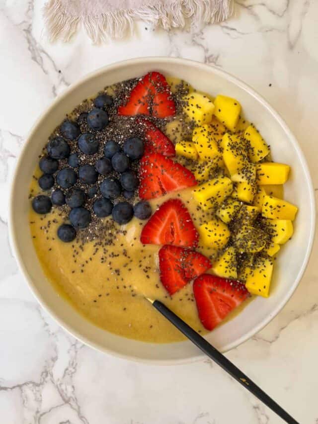 mango magic smoothie bowl with protein powder - Feasty Travels