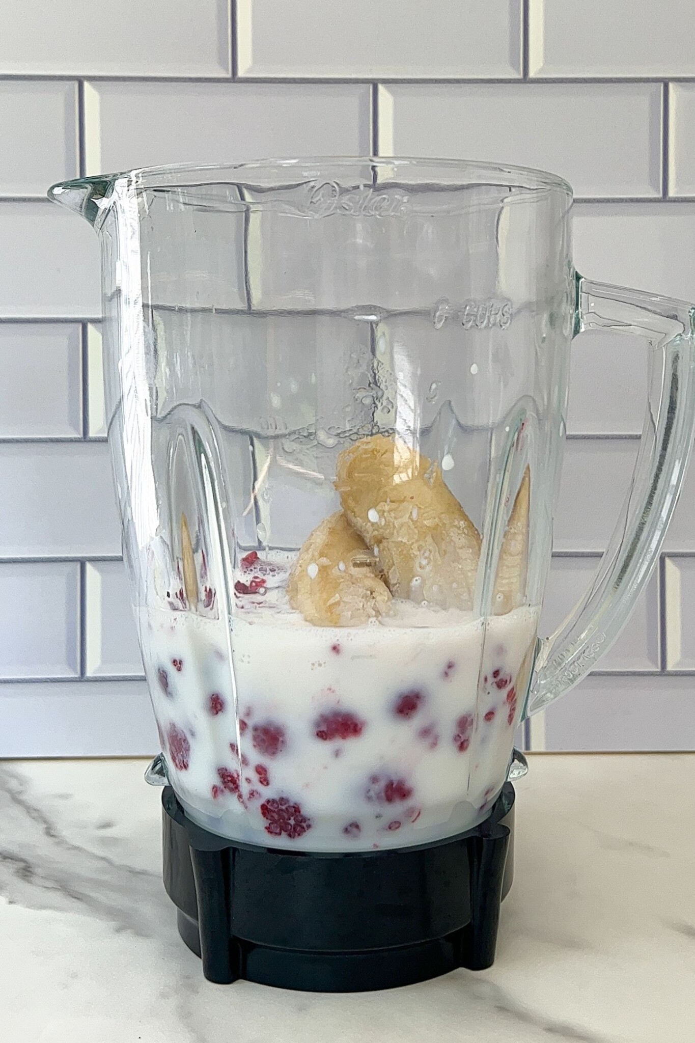 Raspberry Smoothie with Frozen Fruit - Feasty Travels