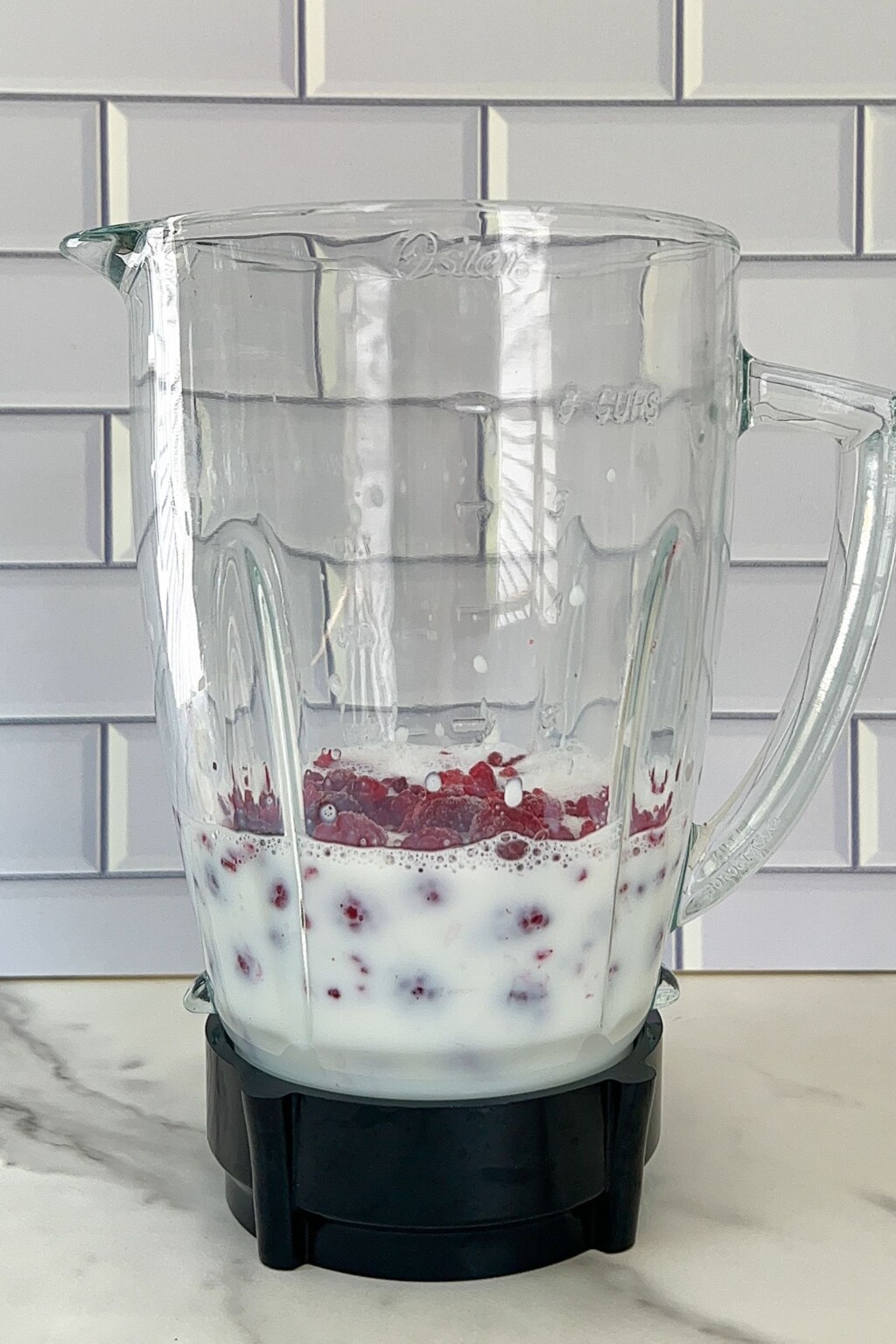Raspberry Smoothie with Frozen Fruit - Feasty Travels