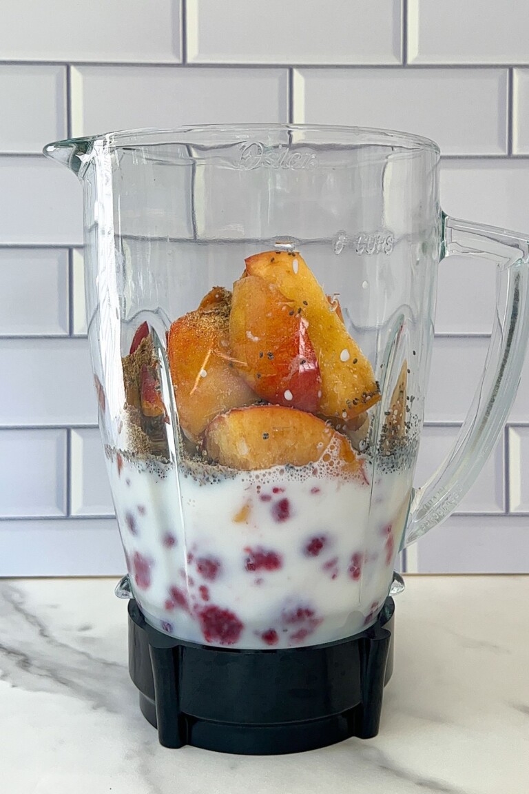 Raspberry Smoothie with Frozen Fruit - Feasty Travels